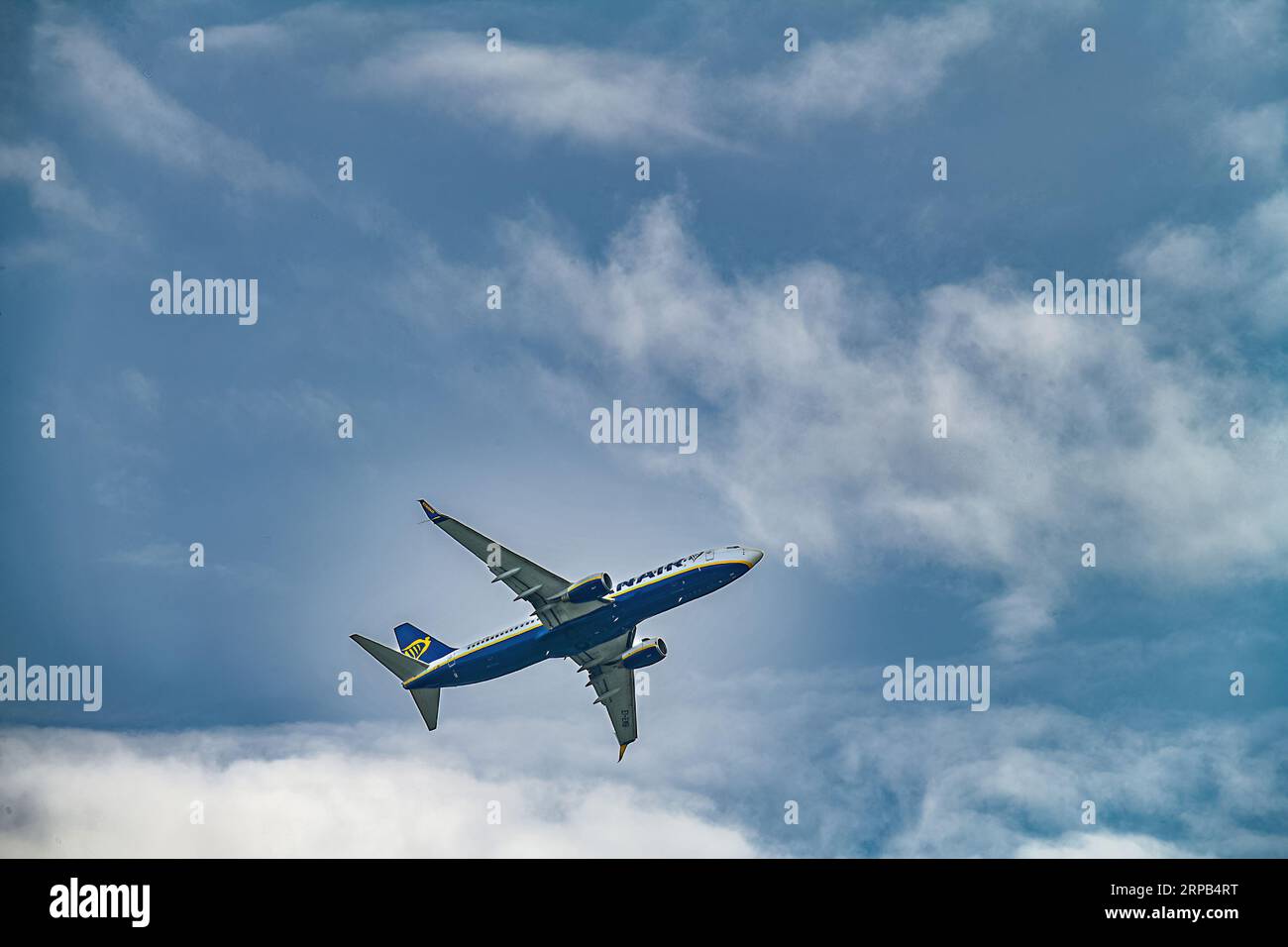 Ryanair airplane from the underside flying overhead with its landing ...