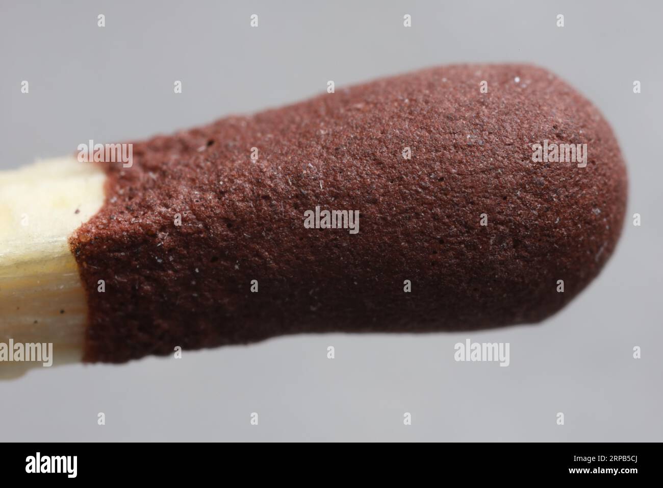 Macro photo of match head on light grey background Stock Photo - Alamy