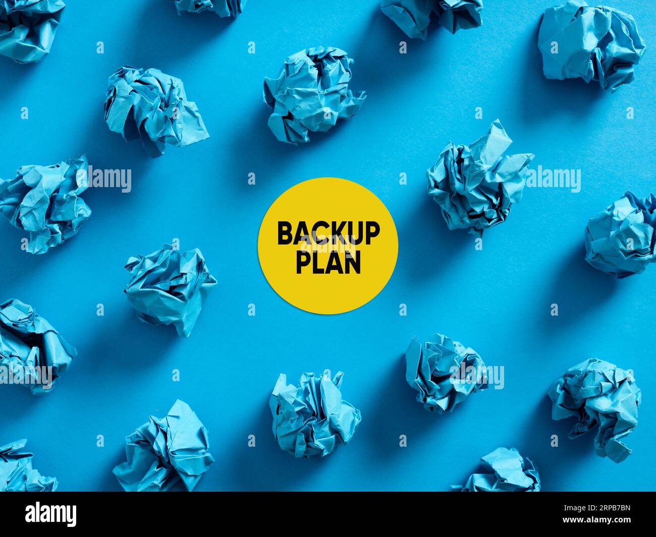 Backup plan message with crumpled blue paper balls on blue background ...