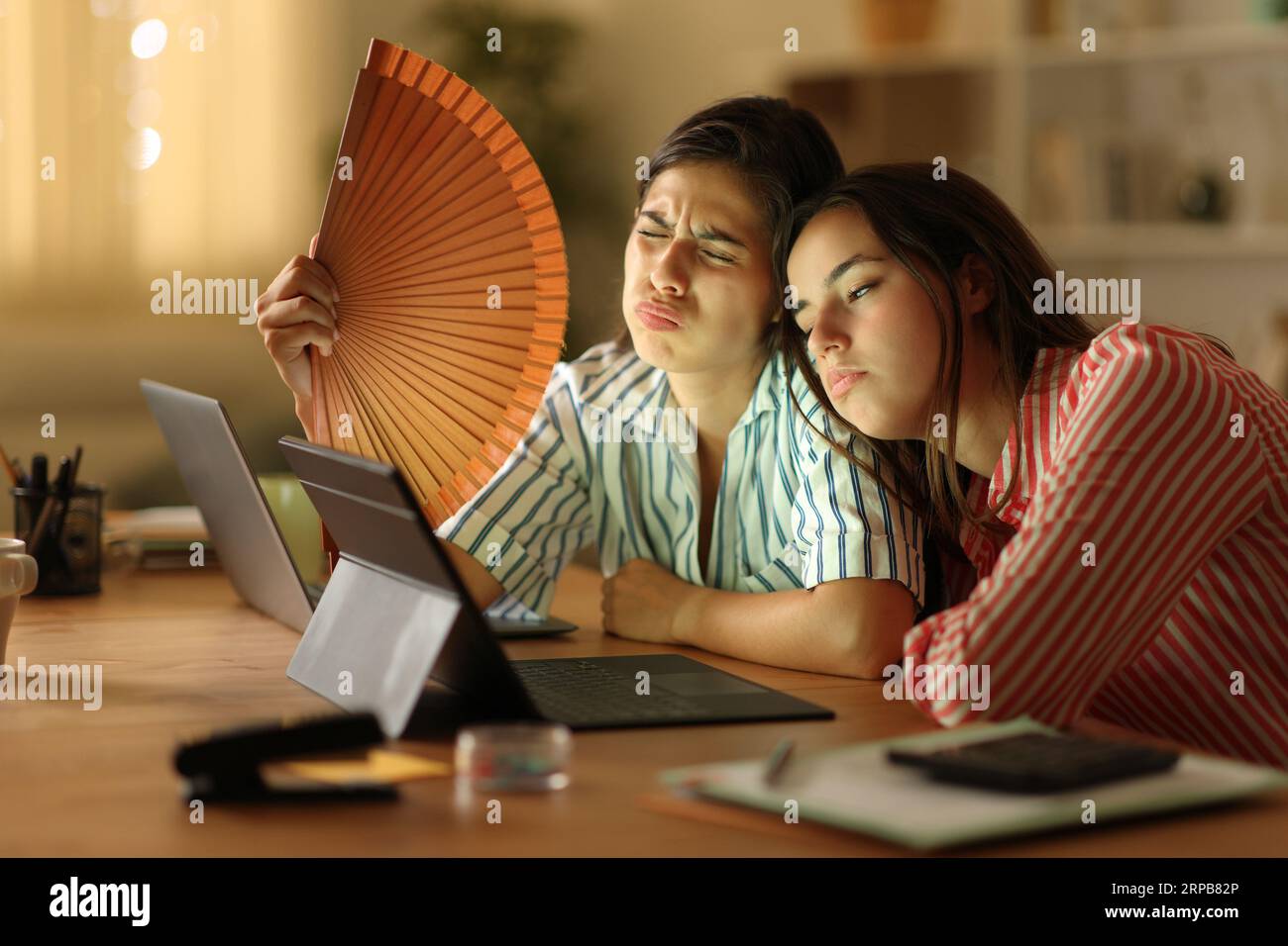 Stressed teleworkers fanning suffering heat stroke working at home in ...