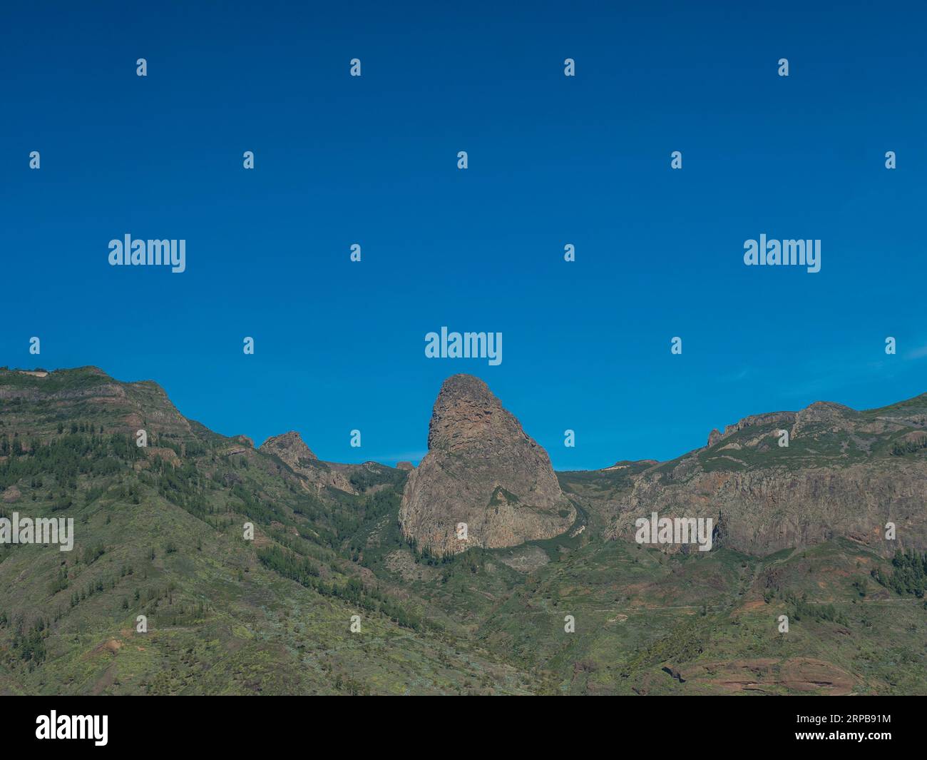 Scenic landscape with Roque de Agando rock at hiking trail through ...