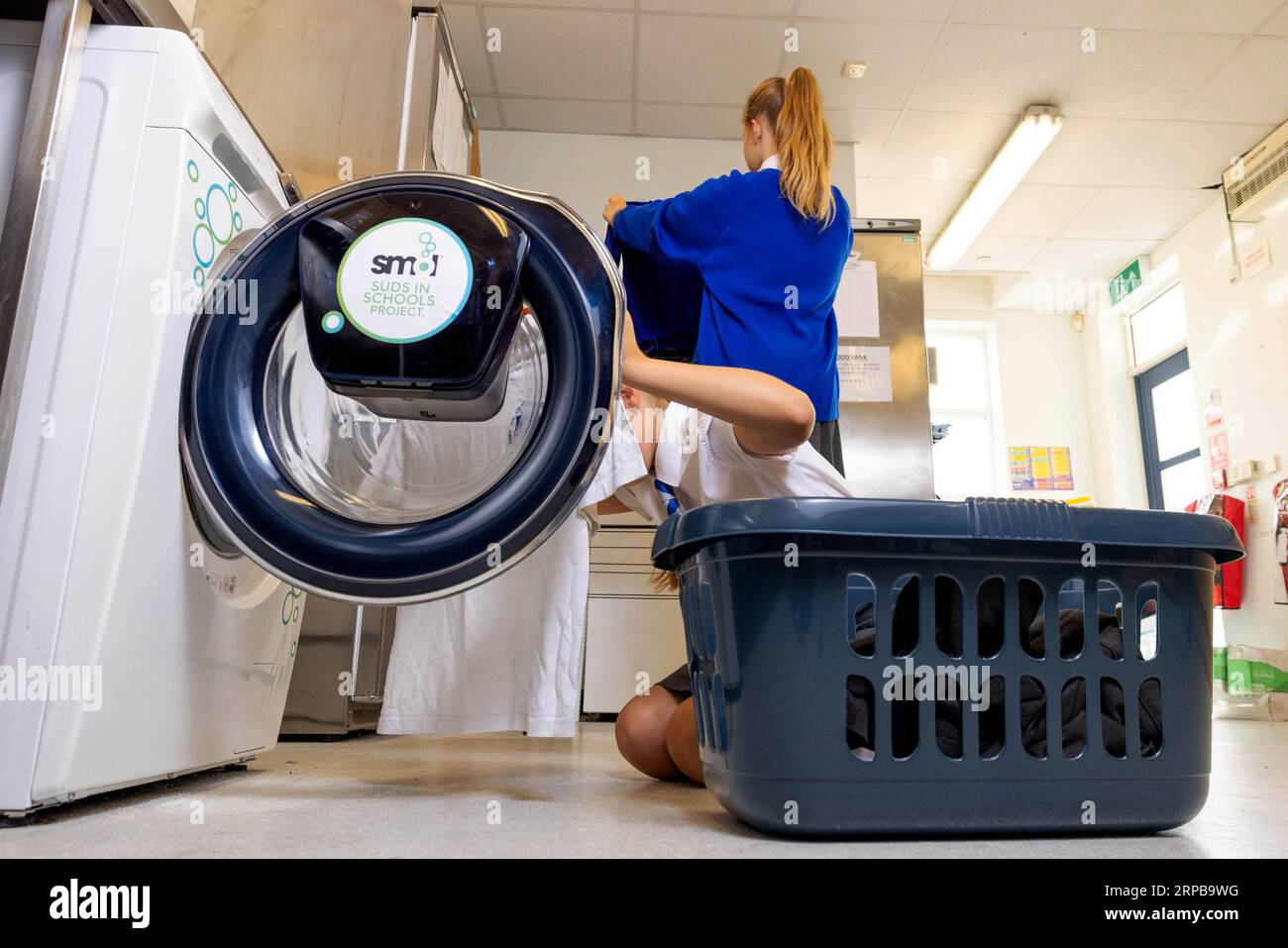 EDITORIAL USE ONLY Pupils use the laundry facilities at St. Cuthbert's ...