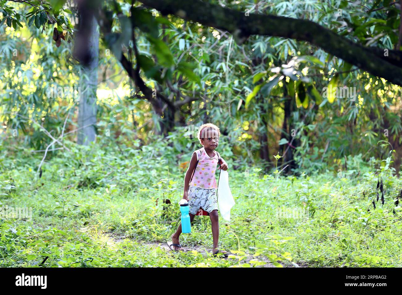 (190603) -- PAMPANGA PROVINCE, June 3, 2019 -- A girl from the indigenous group Aeta walks to ...