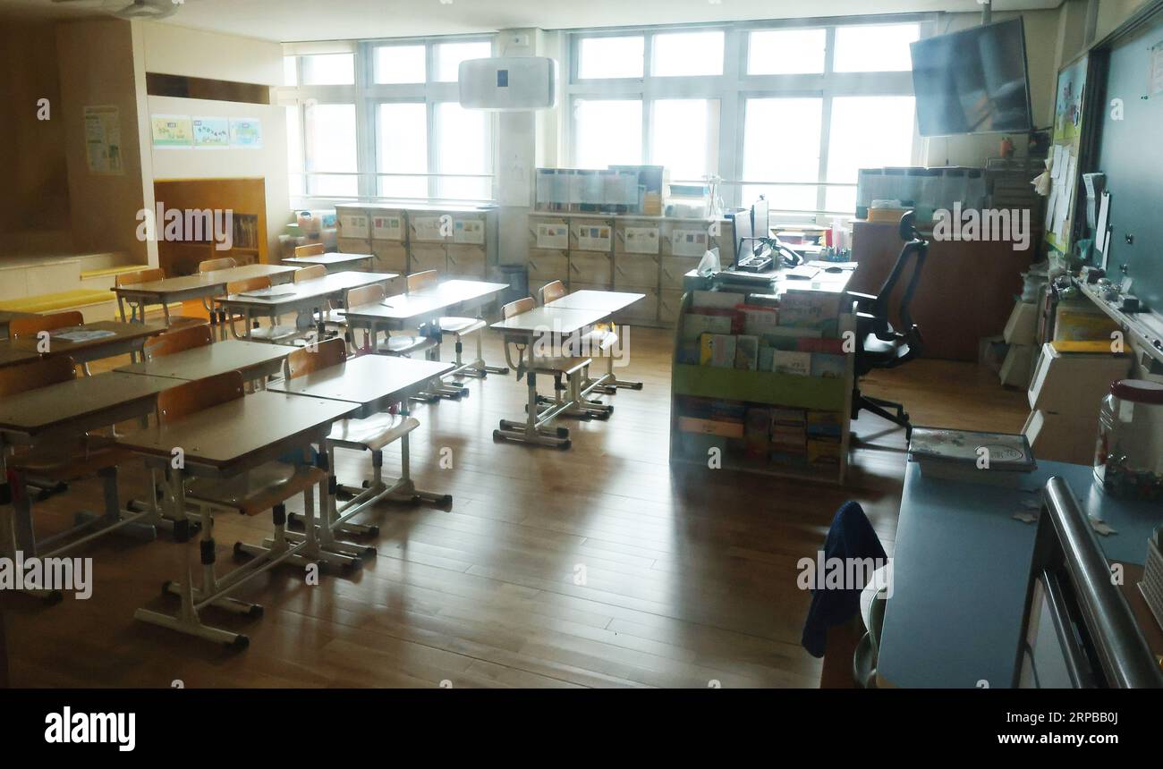 School in temporary shutdown An empty classroom stands silent at an ...