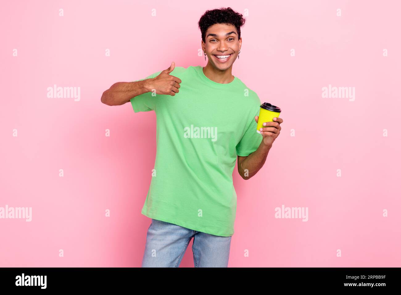 Photo of friendly positive funky guy wear stylish green outfit thumb up ...