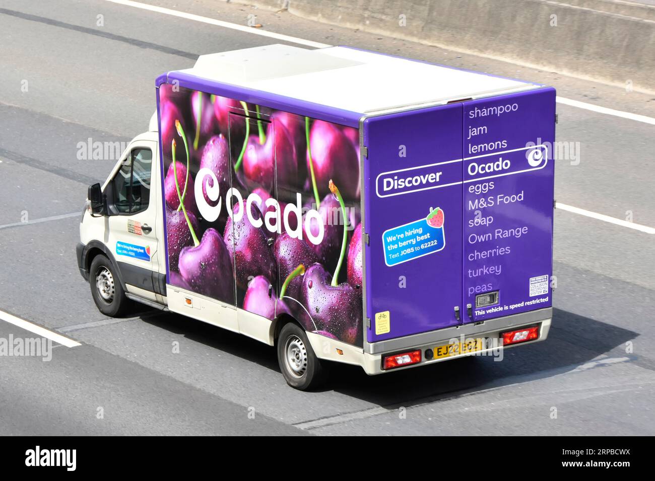 Side back rear & roof aerial view from above looking down colourful Ocado online grocery food ...