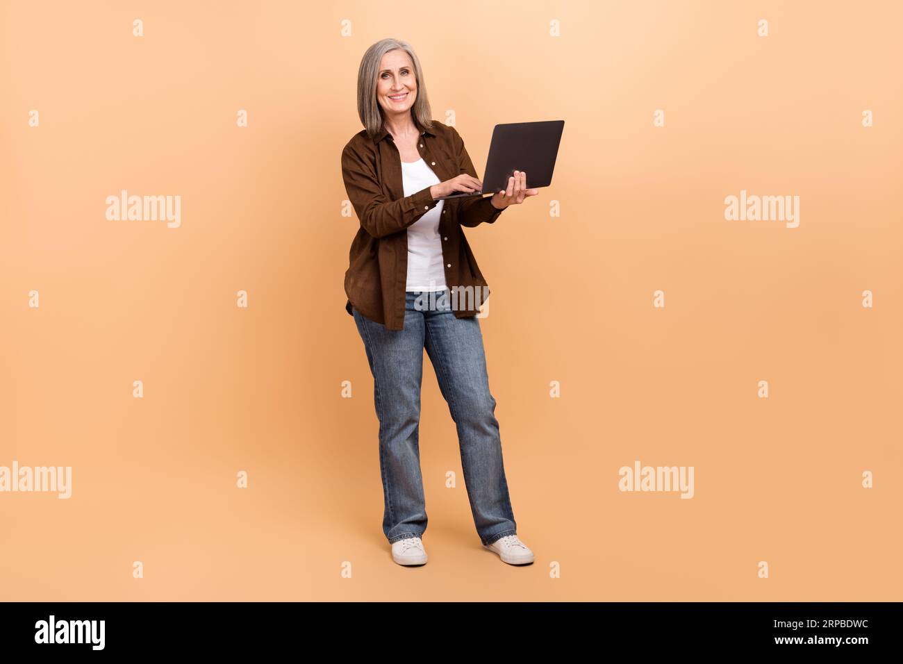 Full body photo of senior lady wear brown shirt project it specialist ...