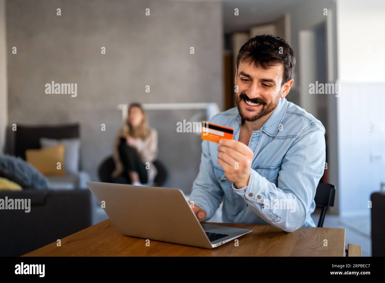 Technology people online shopping concept. Happy smiling man with ...