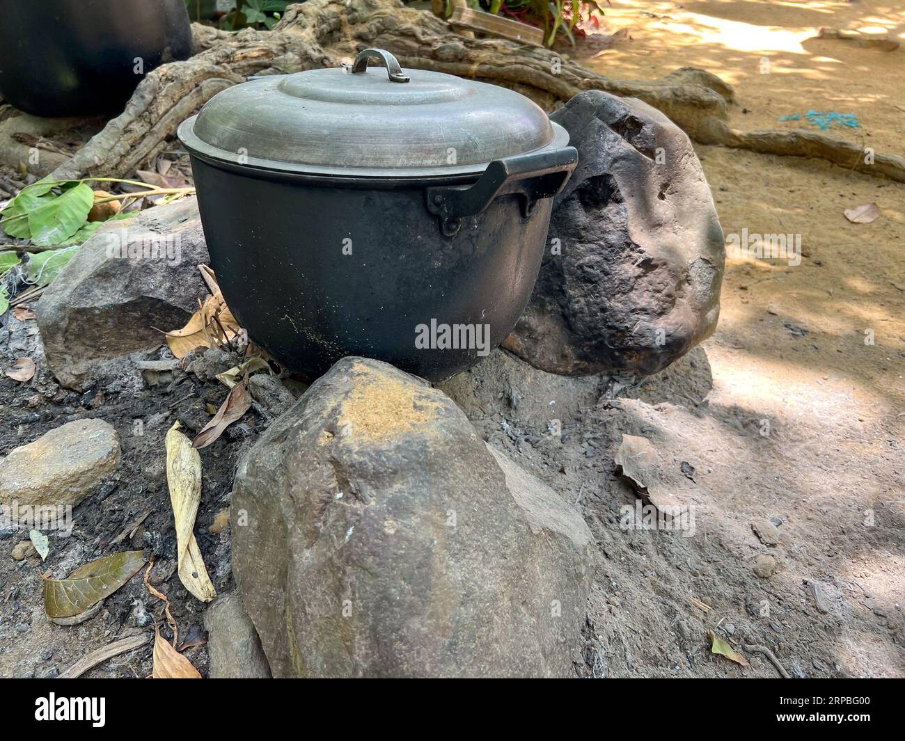 Traditional primitive Philippine style ground cooking using rocks and ...