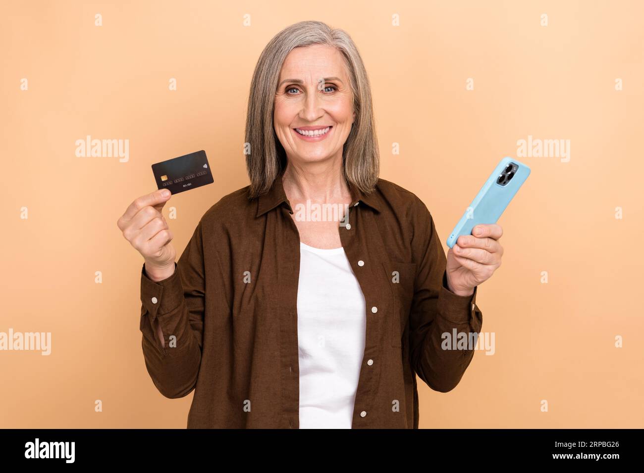 Portrait of optimistic person with bob hair wear jacket hold smartphone ...