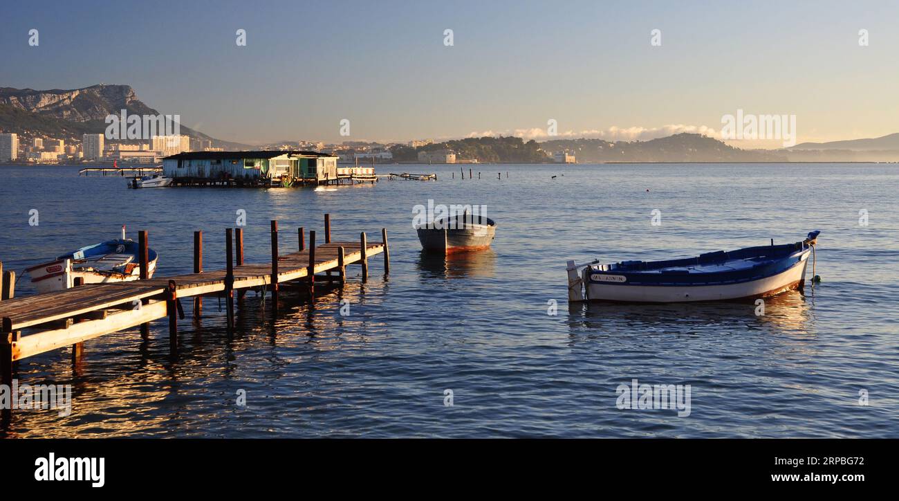 Local fishing boat at the Balaguier cove and fish farm house in ...