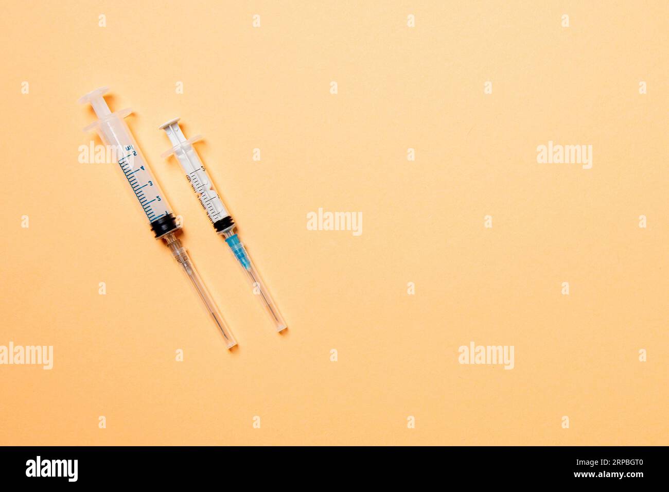Top view of medical syringes on colorful background with copy space ...