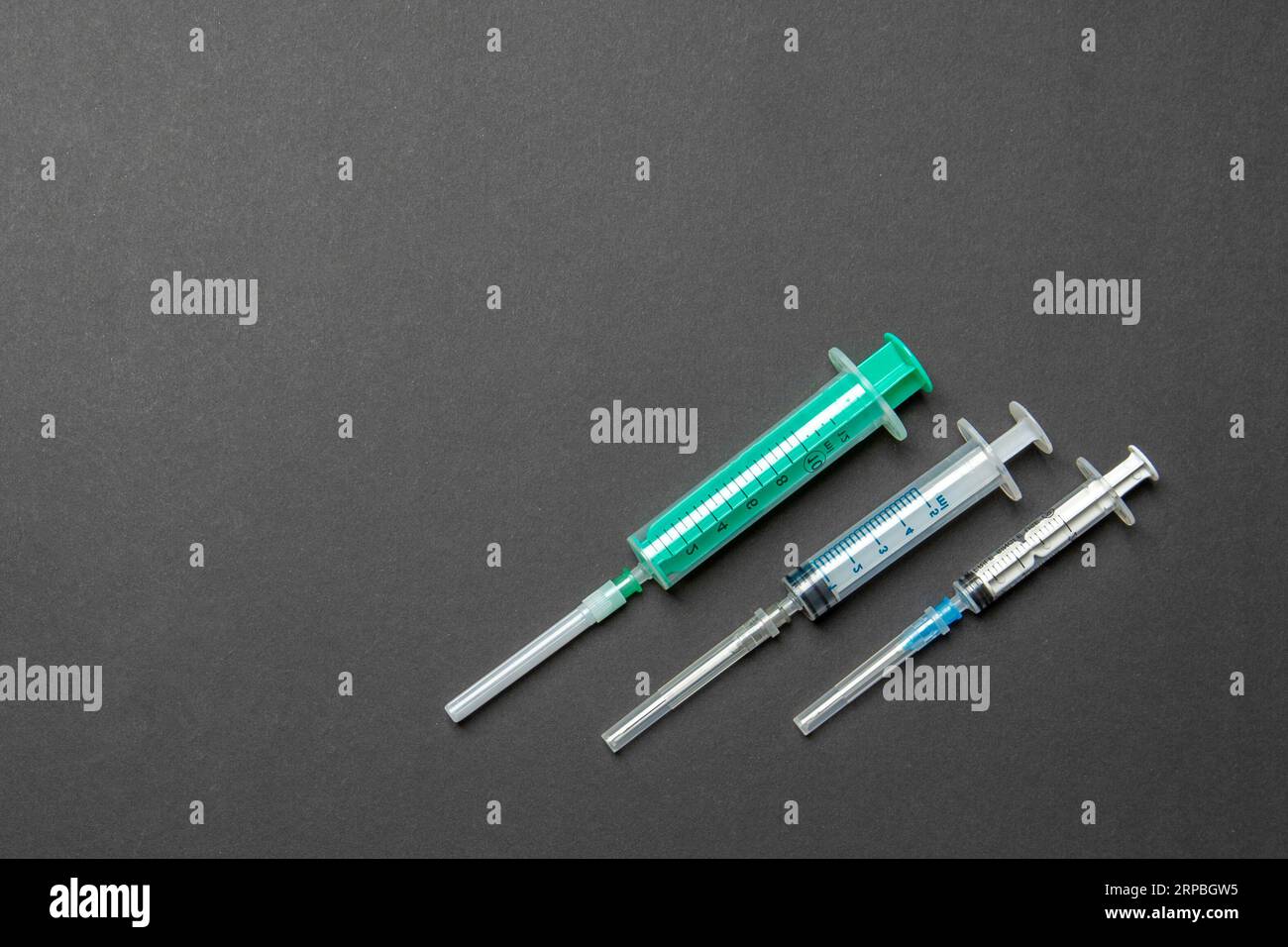 Top view of different syringes for injection on colorful background ...