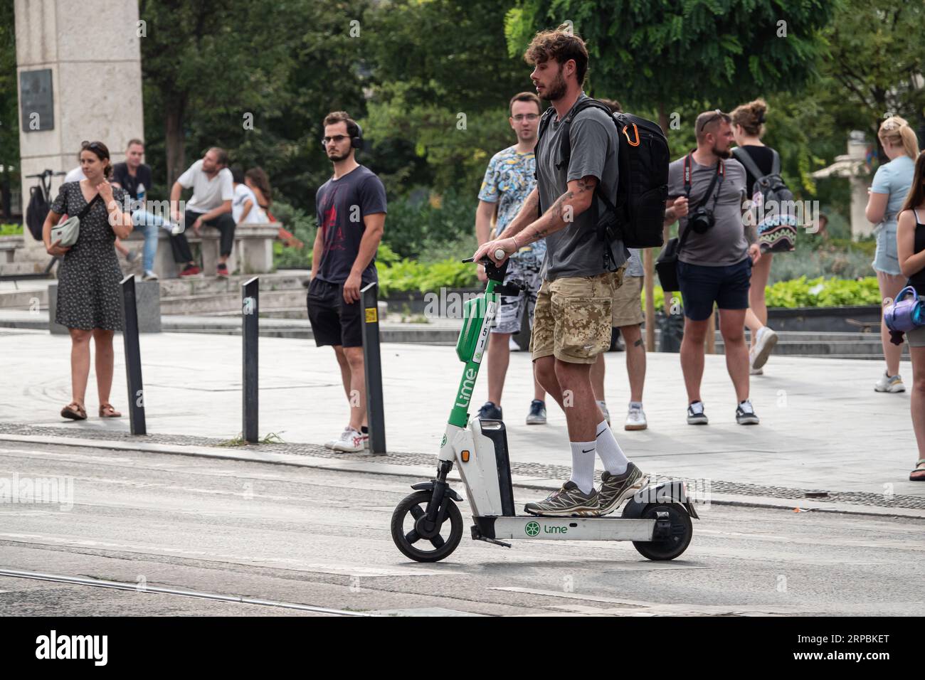 People on electric scooters through the streets Stock Photo - Alamy
