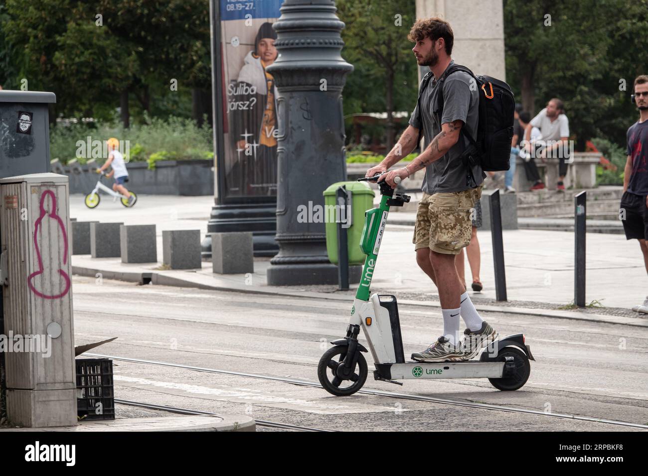 People on electric scooters through the streets Stock Photo - Alamy