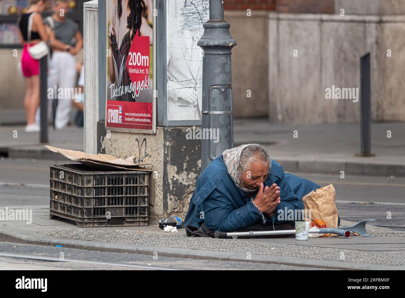 Image of a beggar begging and praying on the streets of Budapest Stock ...