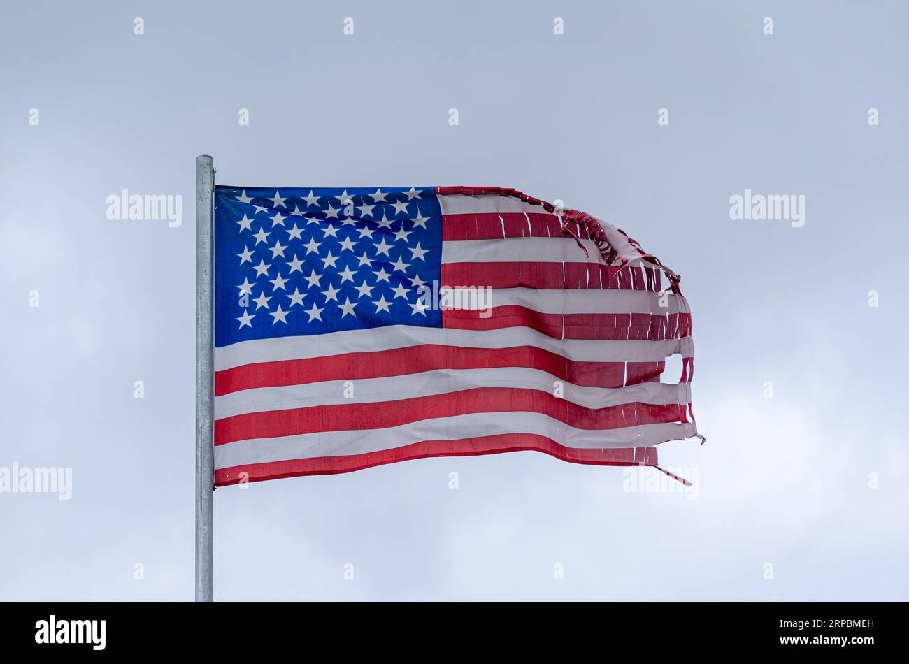 U.S. flag deteriorated by the weather Stock Photo - Alamy