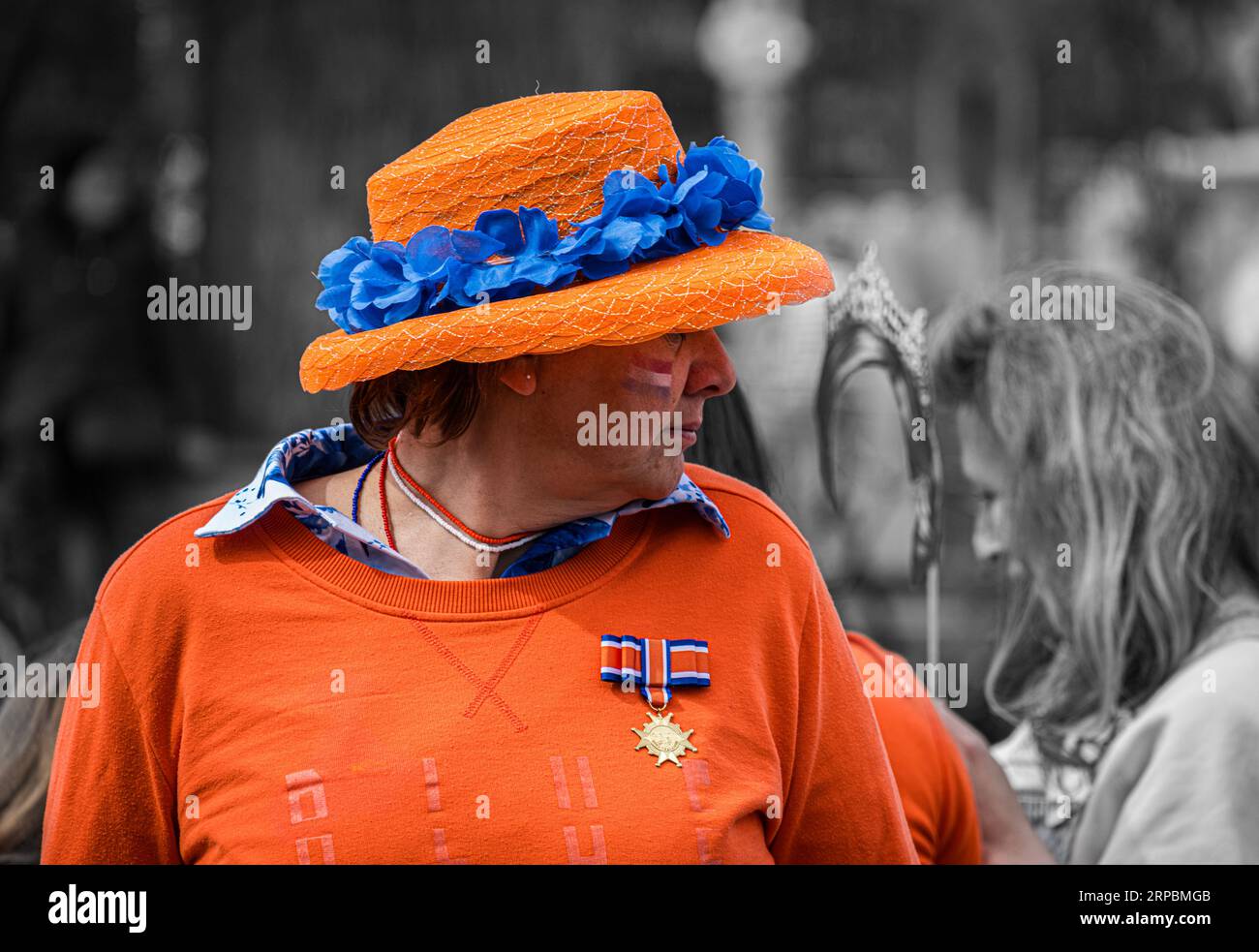 Amsterdam, Netherlands - April 27 2023: Wearing classic Dutch orange ...