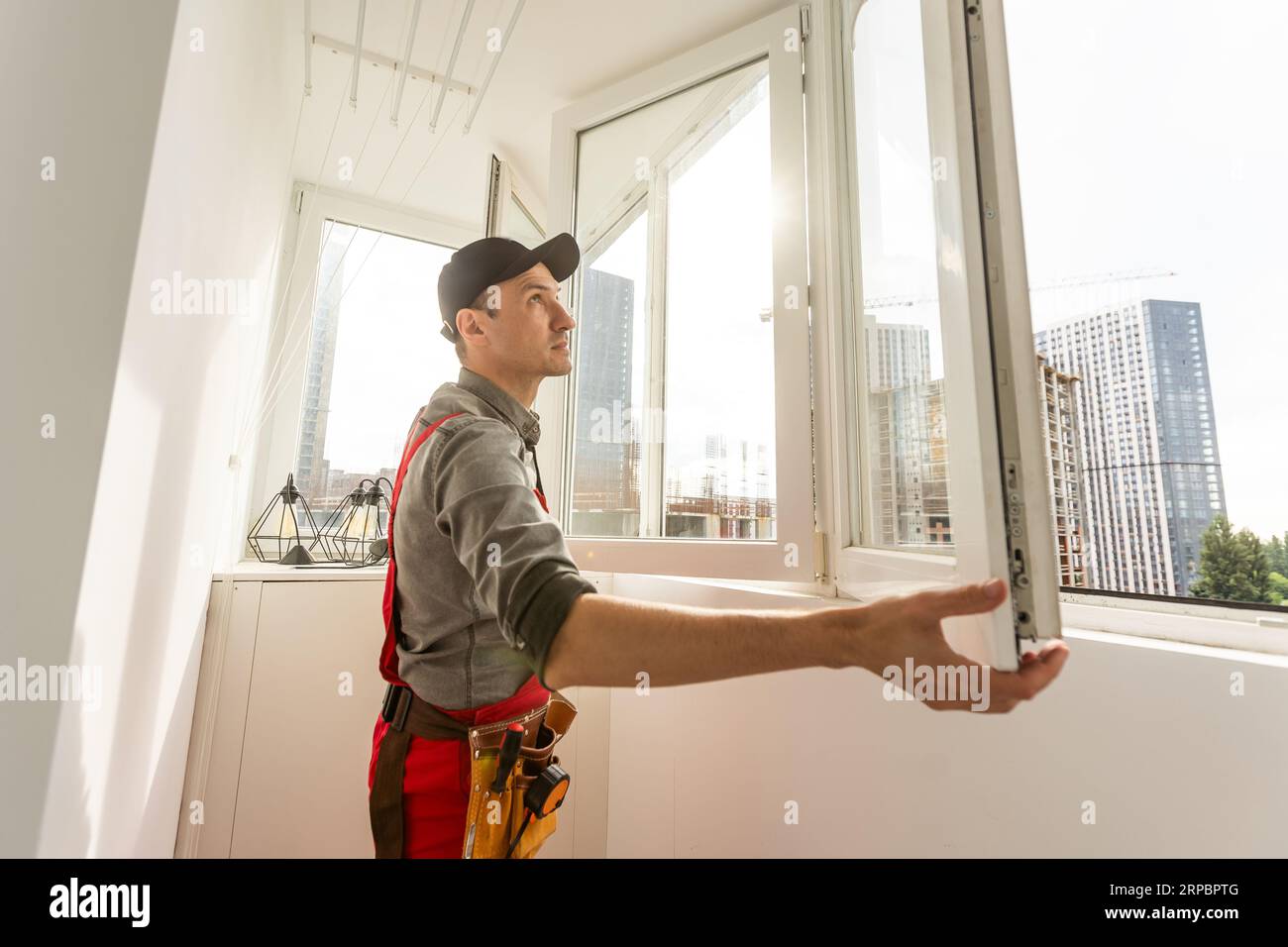 window installation wizard configures window closing Stock Photo - Alamy