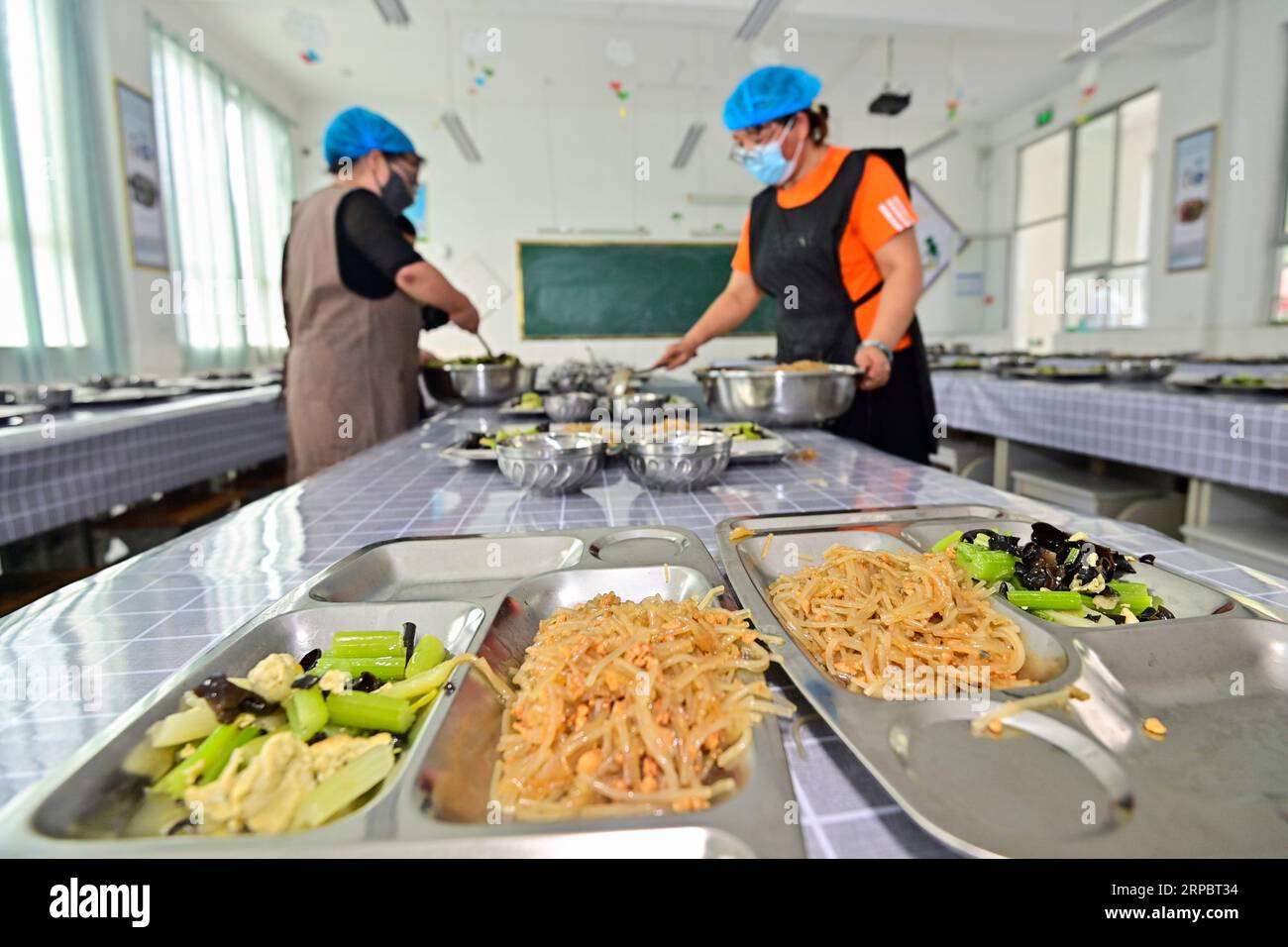 QINGZHOU, CHINA - SEPTEMBER 4, 2023 - A restaurant staff distributes ...