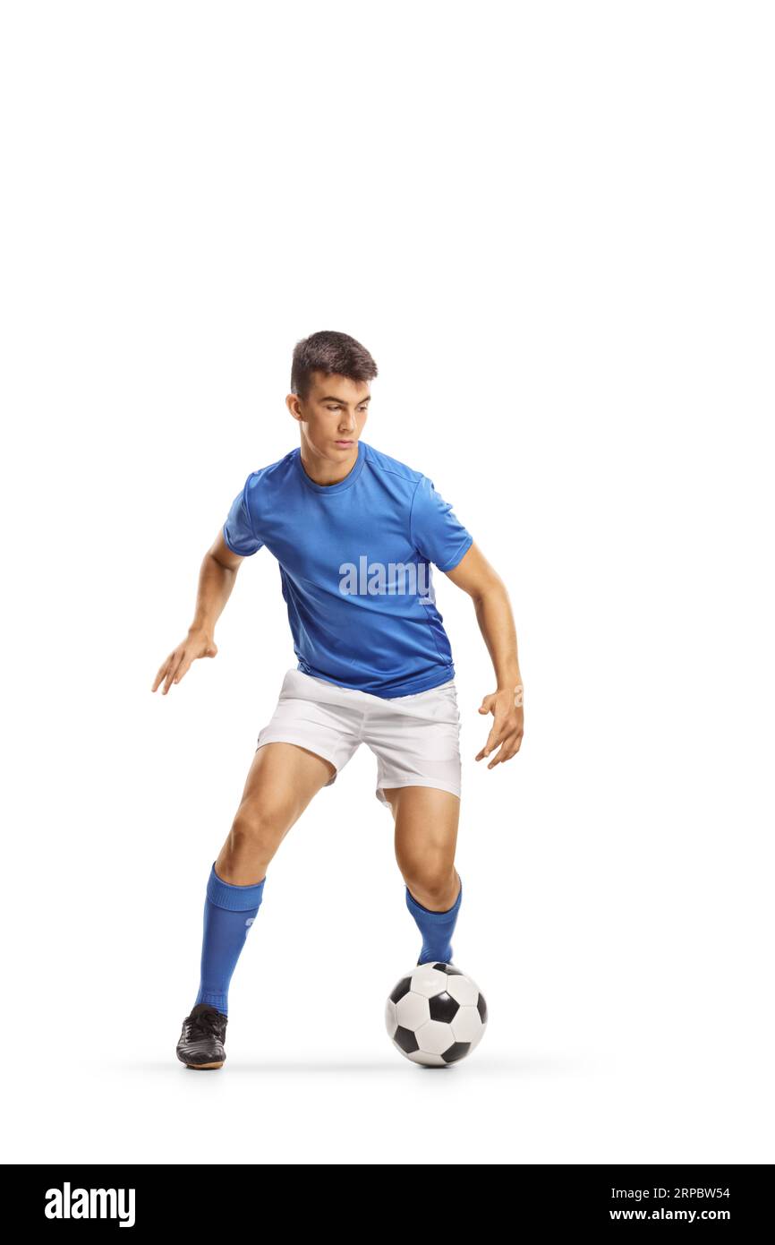 Football player running and leading a ball isolated on white background ...