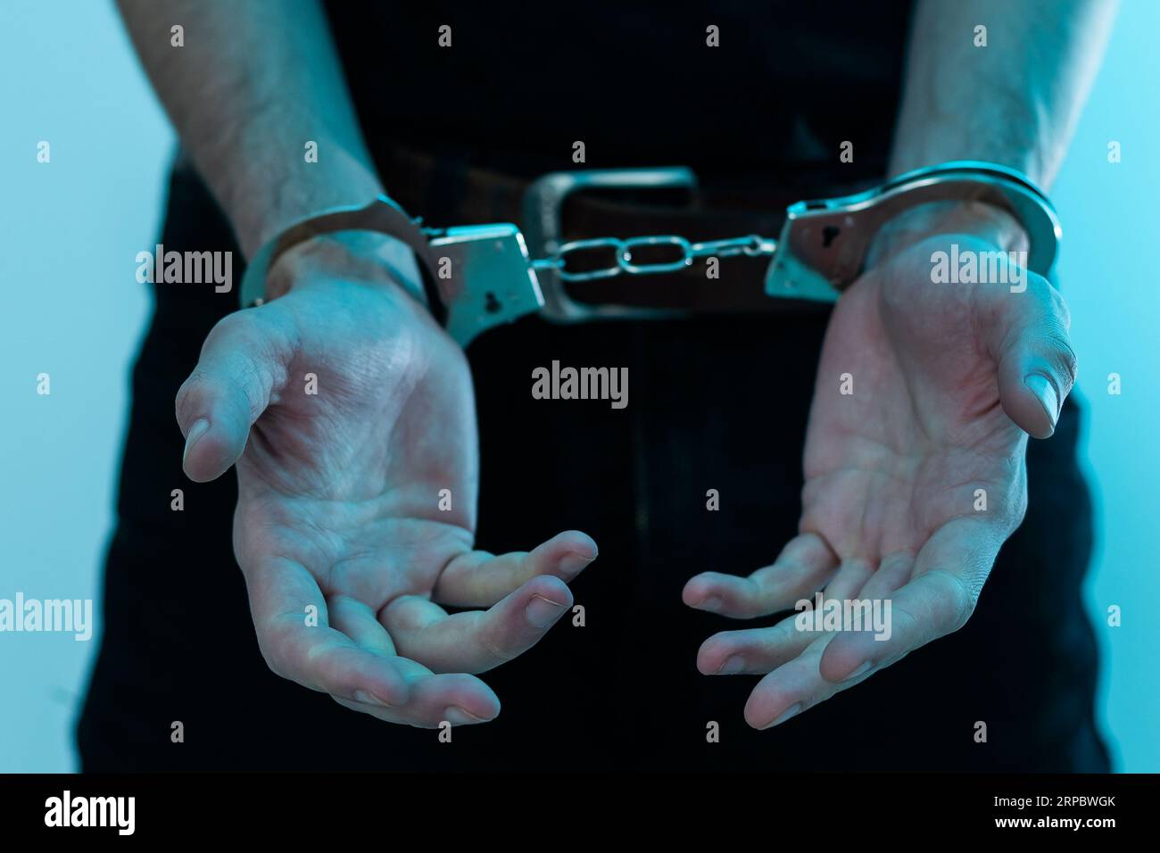 Woman handcuffs behind back hi-res stock photography and images - Alamy