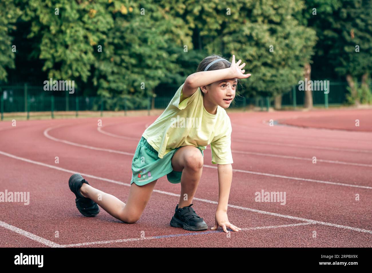 Child fitness, teenager girlsrunning on stadium track Stock Photo - Alamy