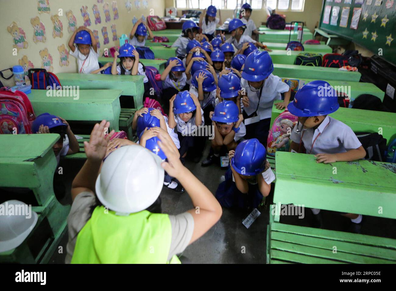 (190620) -- QUEZON CITY, June 20, 2019 -- Students wearing hard hats ...