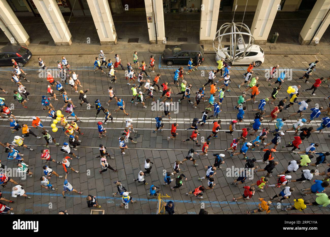 Aerial view of crowd of marathon runners on old road Stock Photo - Alamy