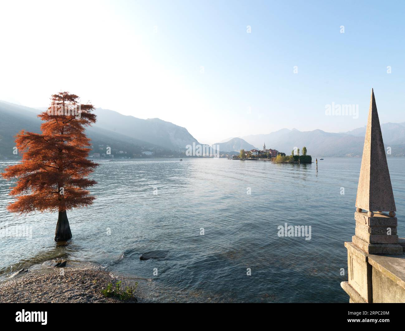 View past tree and Lago Maggiore to Stresa from Isola Bella Stock Photo ...