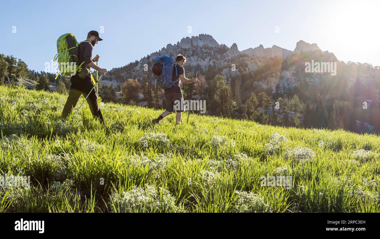 Two Men Hike Towards Utah's Lone Peak Located In The Wasatch Mountains ...