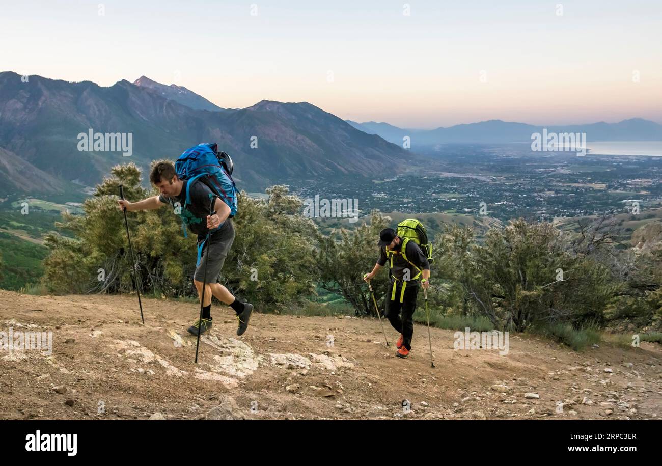 Two Men Hike Towards Utah's Lone Peak Located In The Wasatch Mountains ...