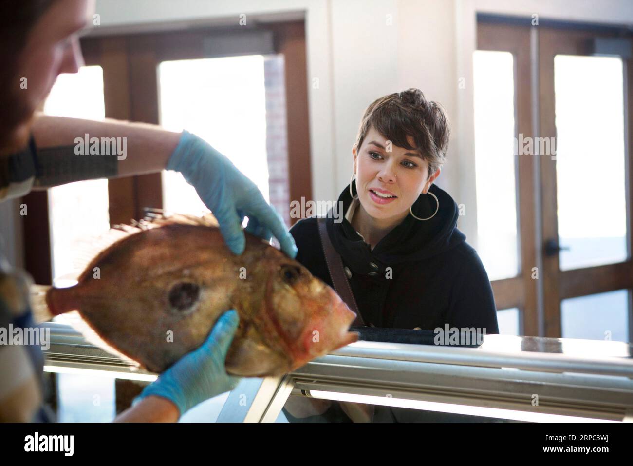 Man selling fish hi-res stock photography and images - Alamy