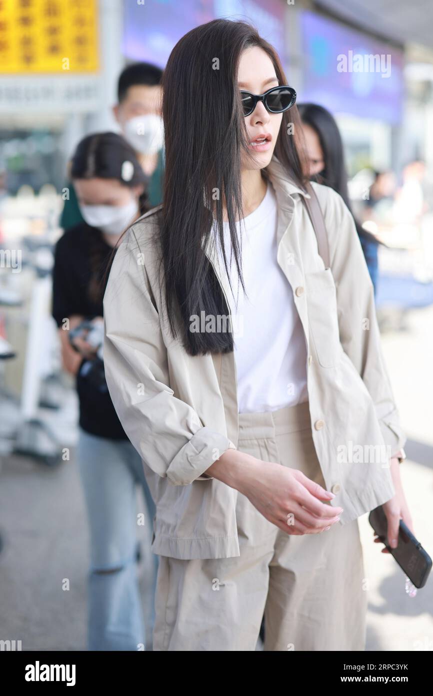 Hong Kong actress and fashion model Janice Man appears at the airport ...