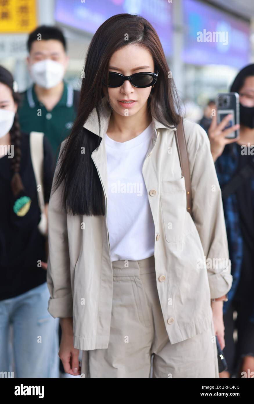 Hong Kong actress and fashion model Janice Man appears at the airport ...