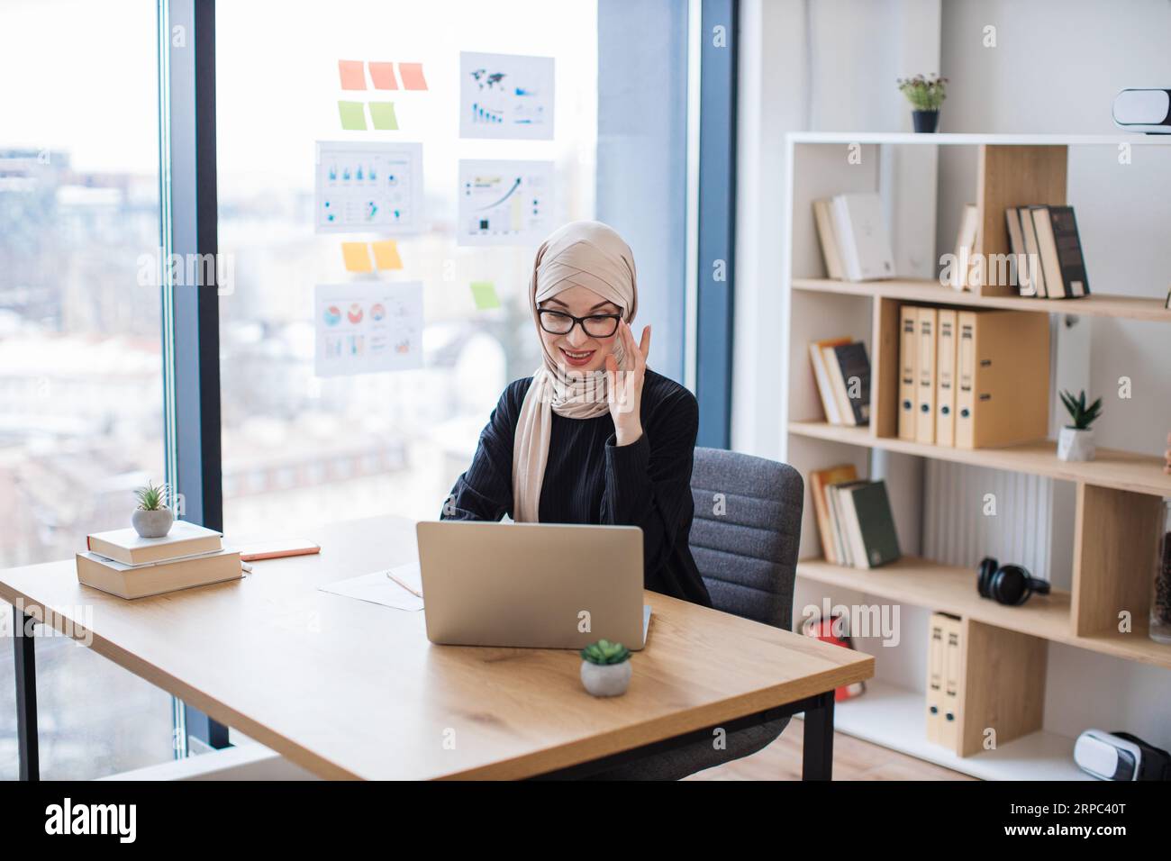 Female professional talking during video conference at work Stock Photo ...