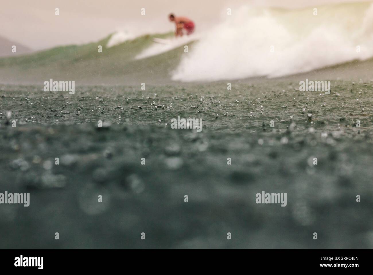 Rain in an ocean Stock Photo - Alamy