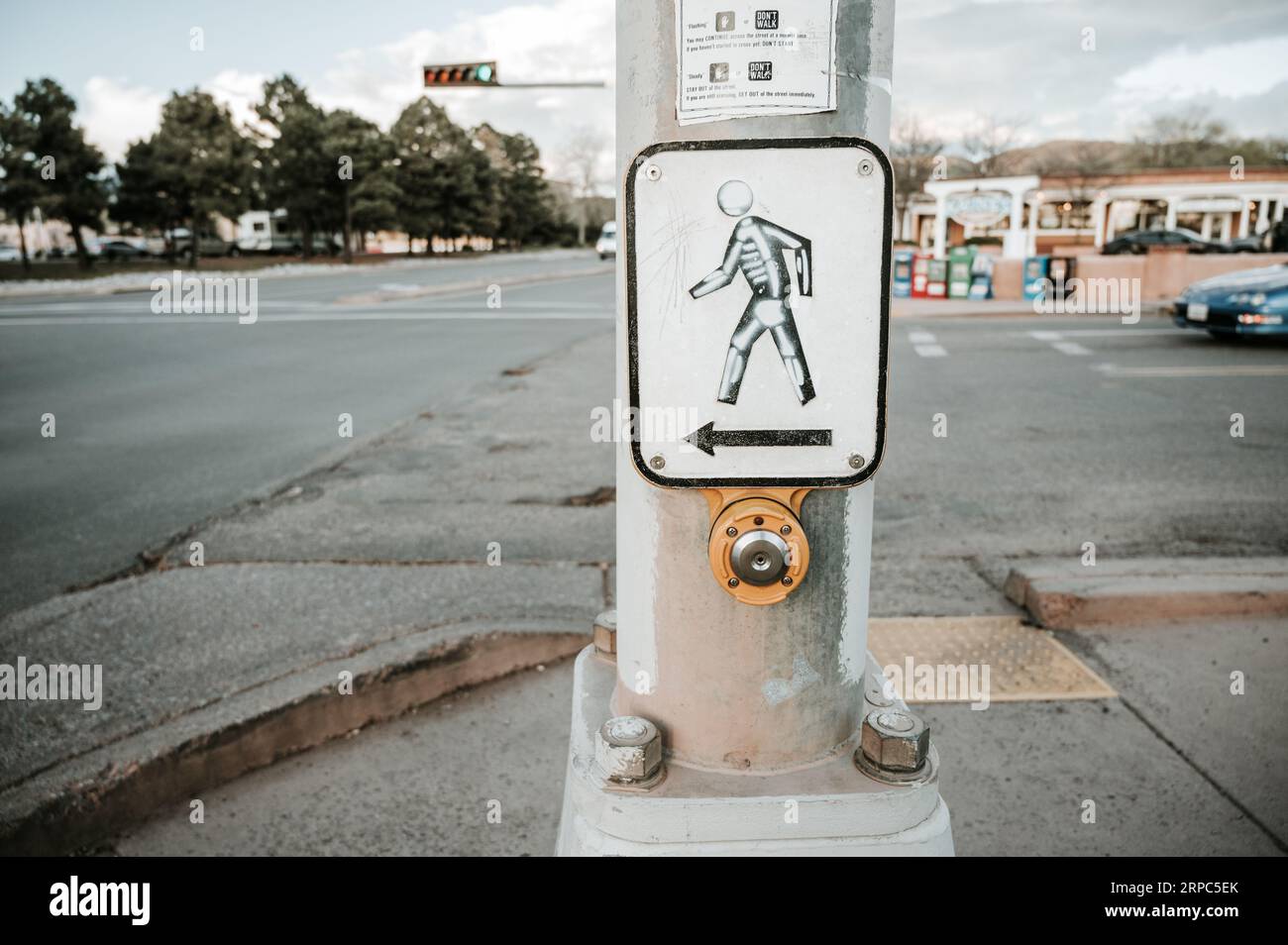 Walk signal sign with street art skeleton painted on by crosswalk Stock ...