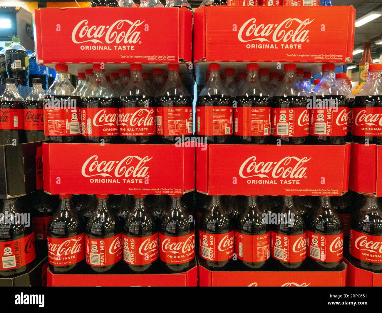 Large plastic bottles of Coca Cola soft in boxes in a supermarket ...