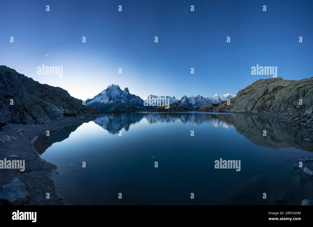 Alpine lake at dawn with reflection of Mont Blanc mountain range Stock ...