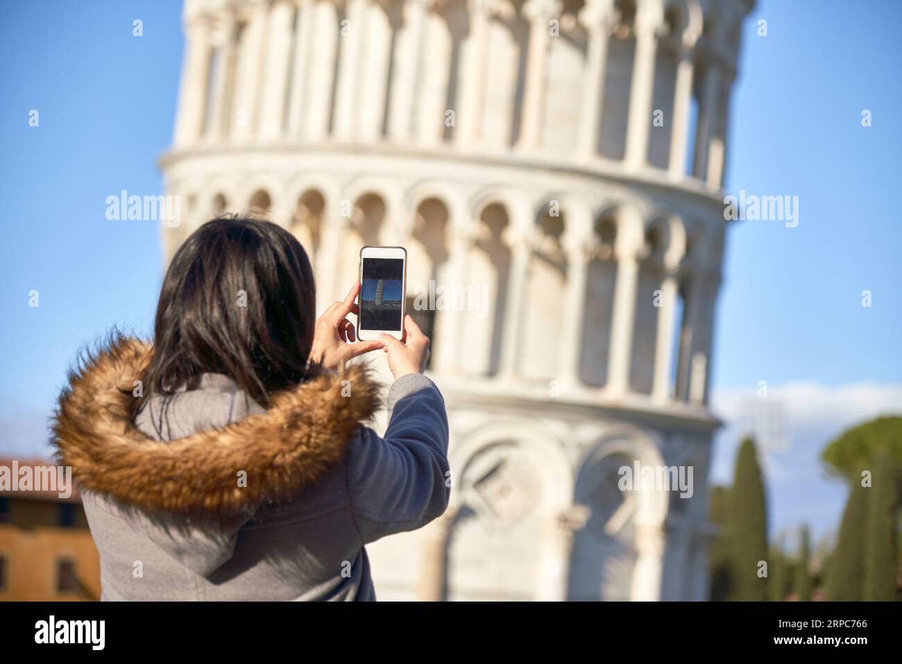 Young tourist leaning tower hi-res stock photography and images - Alamy