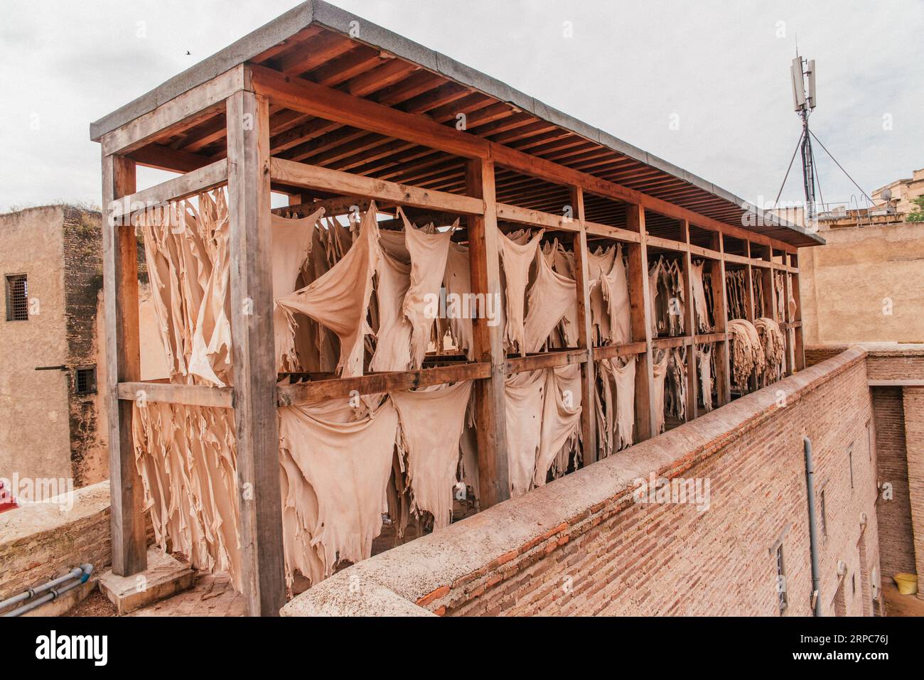View inside of old medina in Fes, a traditional and old tannery with w ...