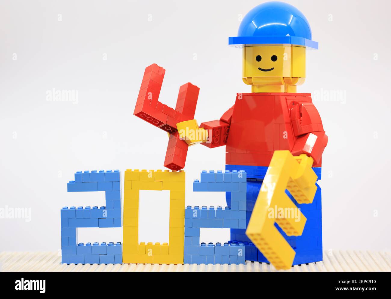 Giant man set up the new year 2024 wording Stock Photo - Alamy