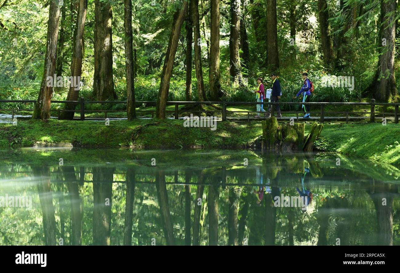 (190629) -- BEIJING, June 29, 2019 -- Tourists visit the Ali Mountain ...