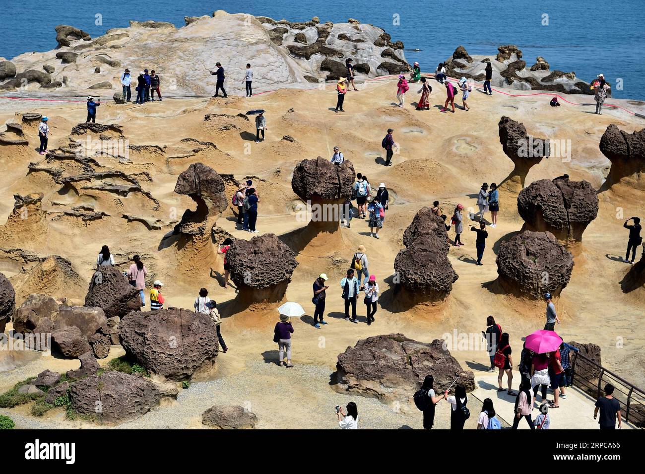 (190629) -- BEIJING, June 29, 2019 -- Tourists visit the Yehliu Geopark ...