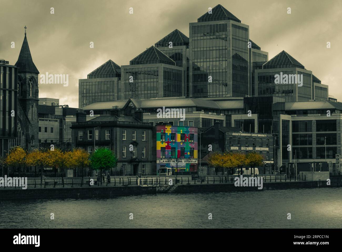 A modern multi-colored building, with various hues of blue, yellow ...