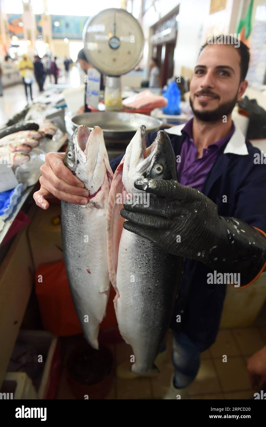 (190701) -- KUWAIT CITY, July 1, 2019 -- A fish vendor shows fishes at ...