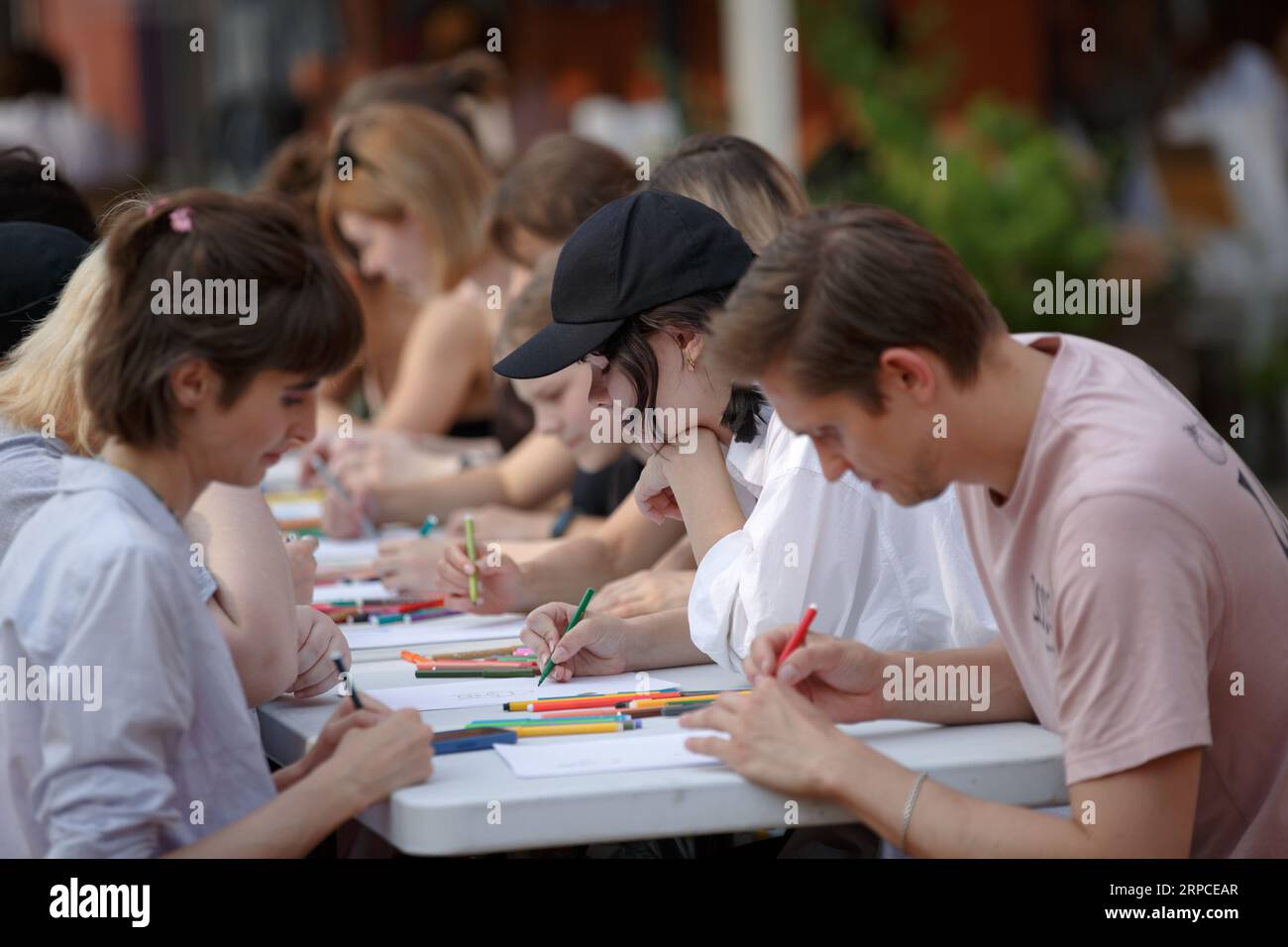 Moscow, Russia, August 27, 2022: A group of people learning how to draw ...