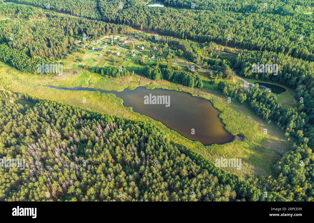 Aerial view of a lake in the forests of Lithuania, wild nature. The ...