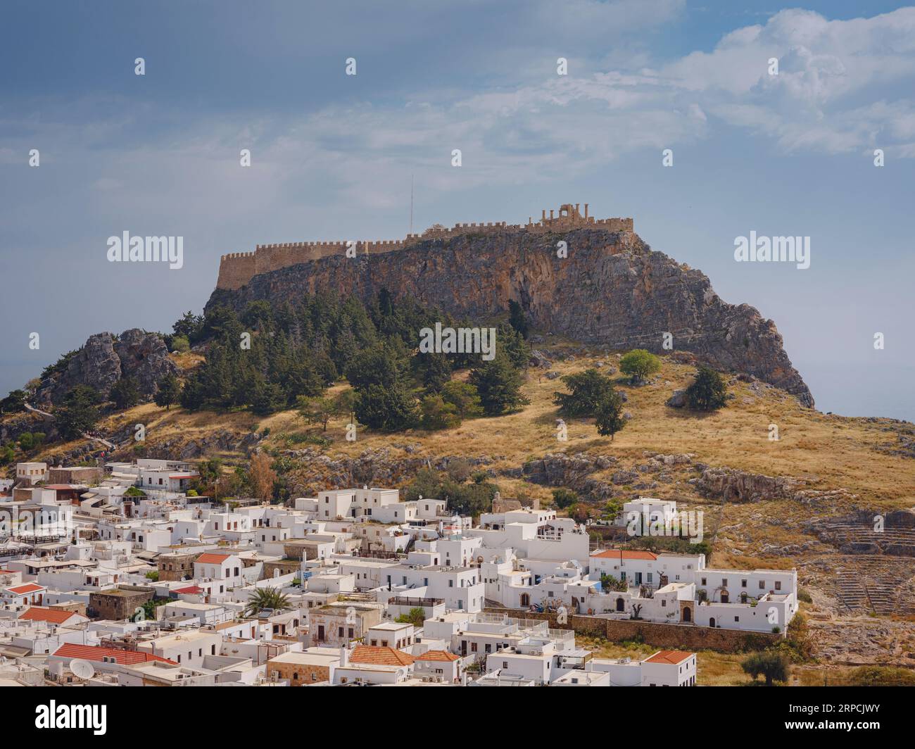 Lindos town in Greece aerial view in cloud summer day, white houses in ...